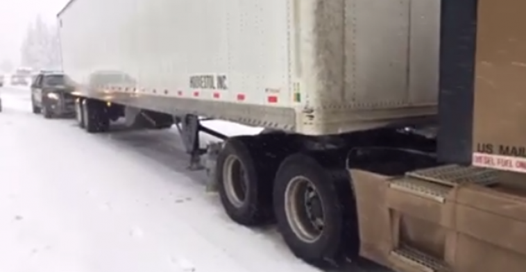 Watch: California Highway Patrol Officers Push Stuck Semi On I-80